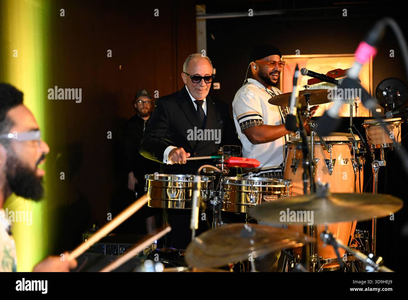 Emilio Estefan plays the drums during Gary Nader Art Centrer kick off ...