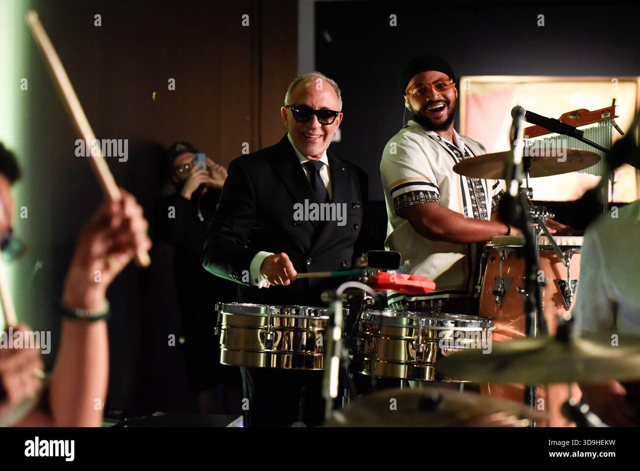 Emilio Estefan plays the drums during Gary Nader Art Centre kick off ...