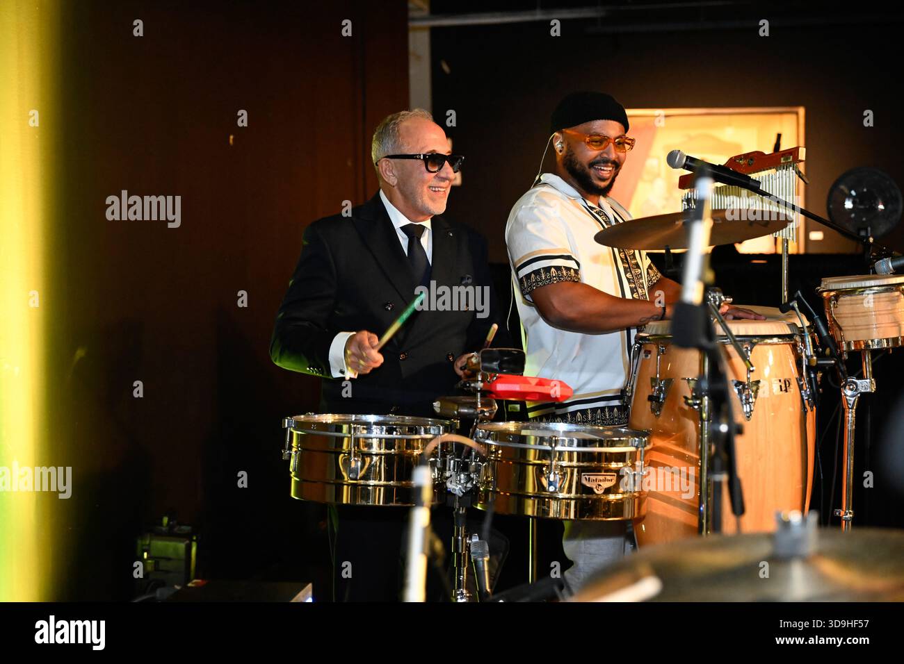 Emilio Estefan plays the drums during Gary Nader Art Centrer kick off ...
