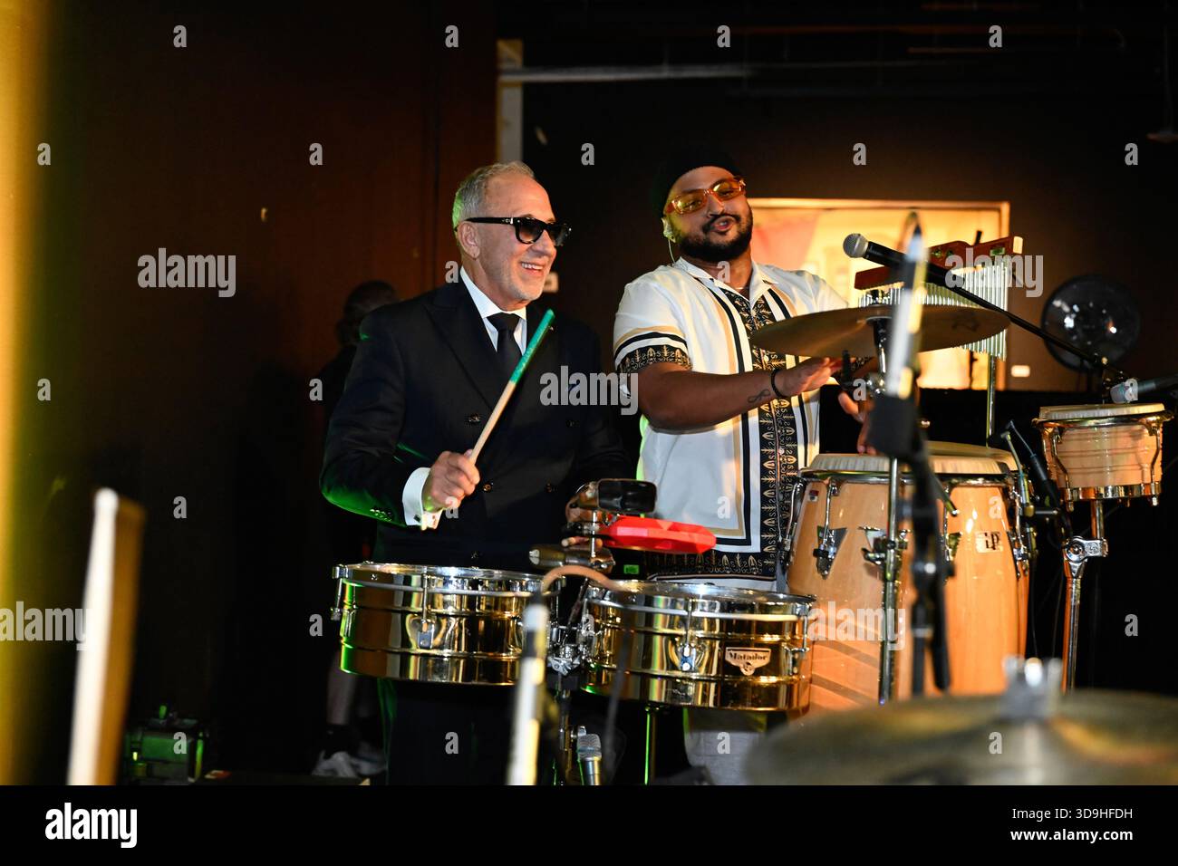 Emilio Estefan plays the drums during Gary Nader Art Centrer kick off ...