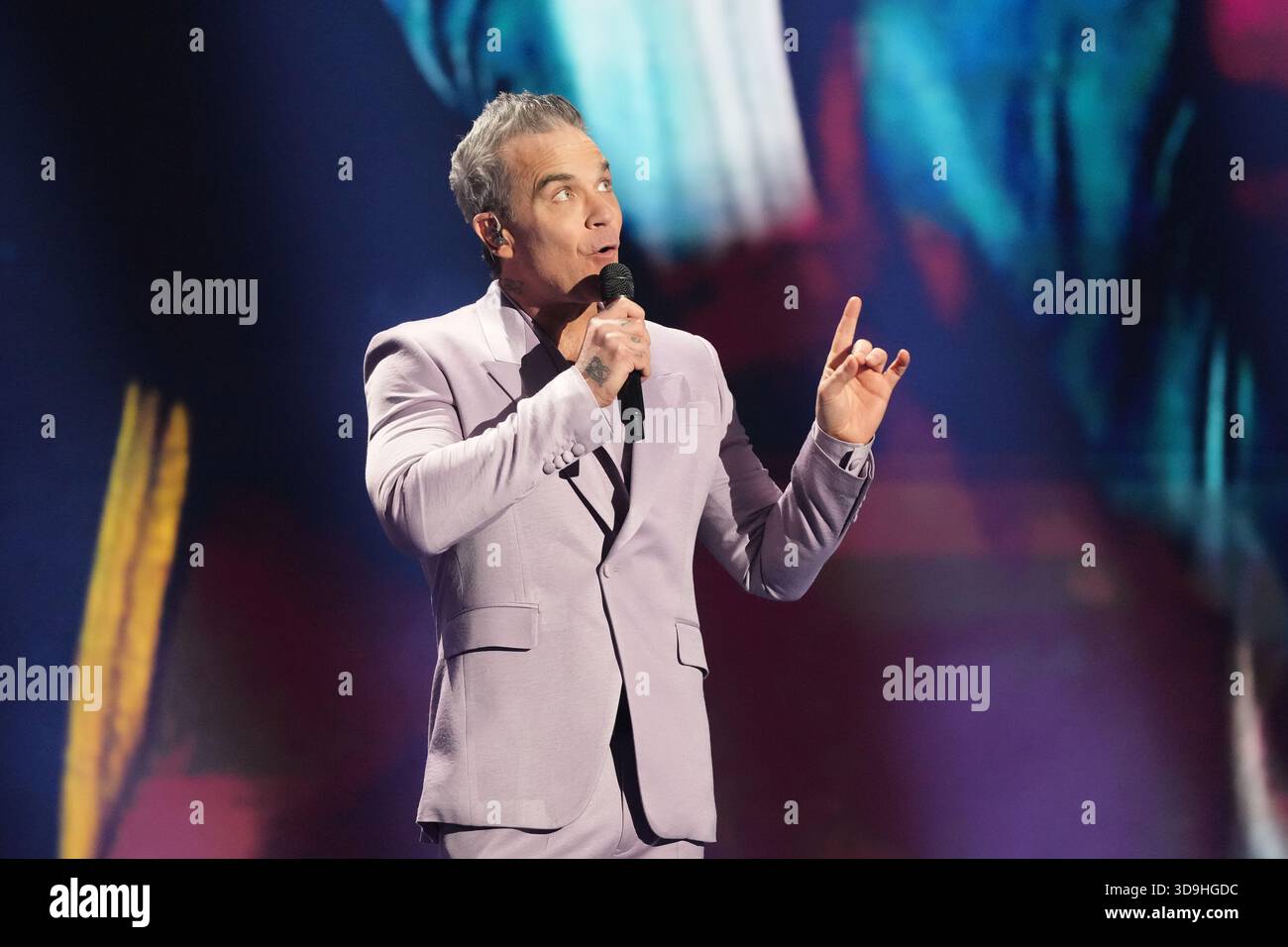 Singer Robbie Williams performs during the draw for the 2026 soccer ...