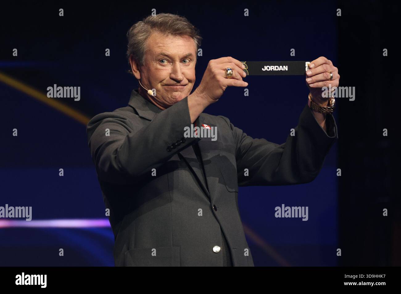 Former NHL player Wayne Gretzky displays Jordan during the draw for the ...