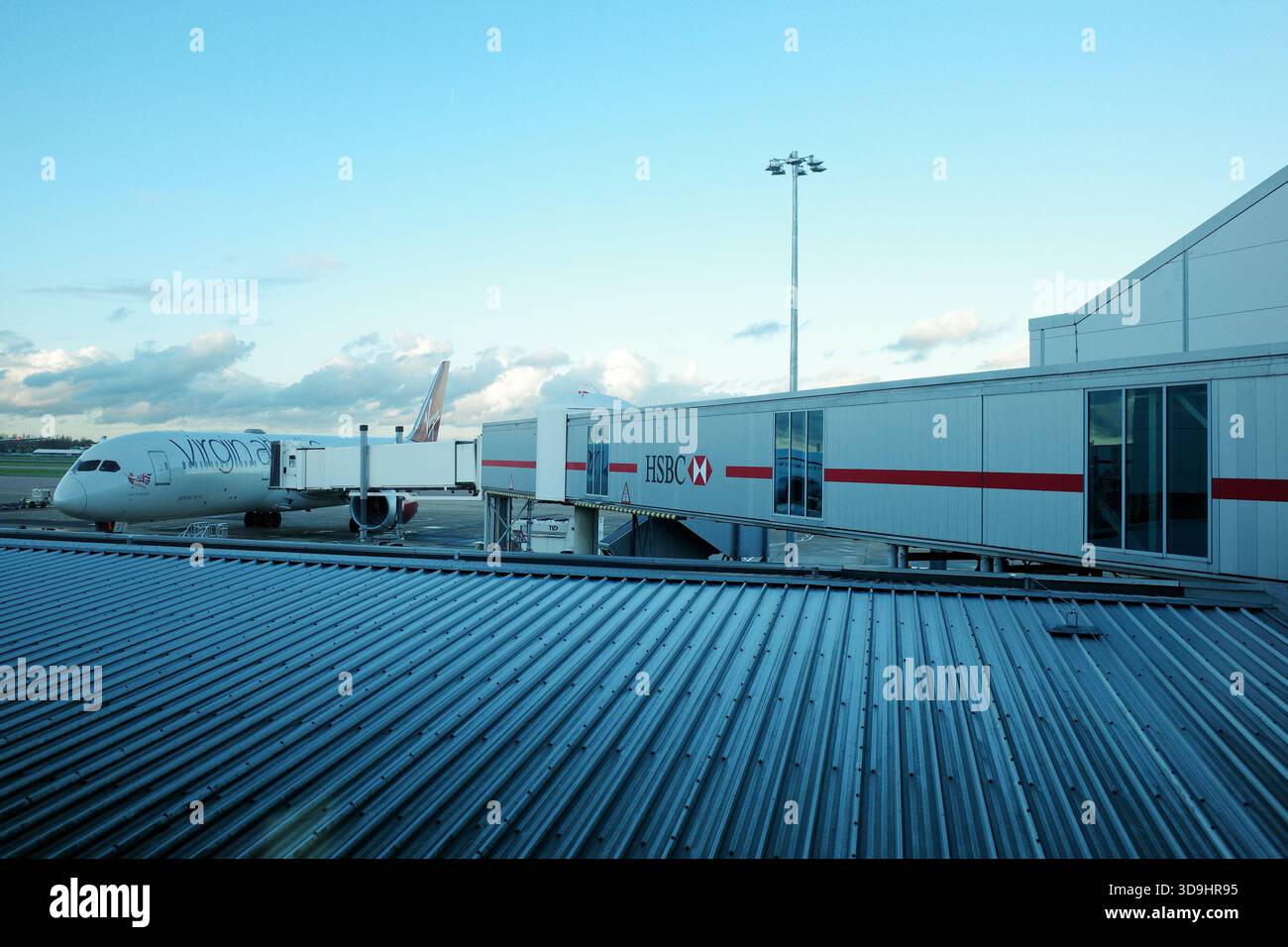 Jet bridge with HSBC signage at Heathrow Airport in London, England ...