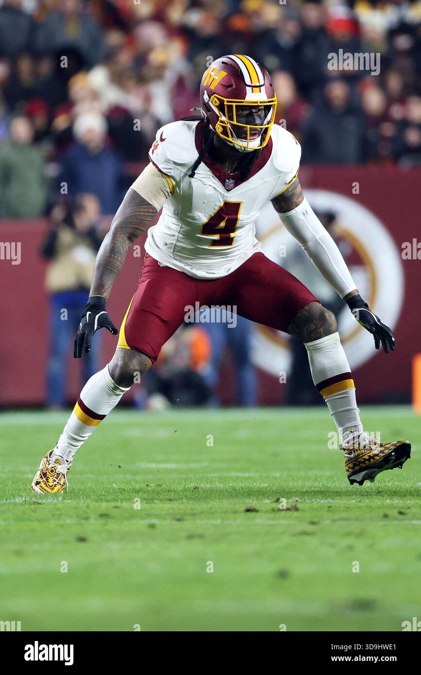 Washington Commanders linebacker Frankie Luvu (4) rushes during an NFL ...