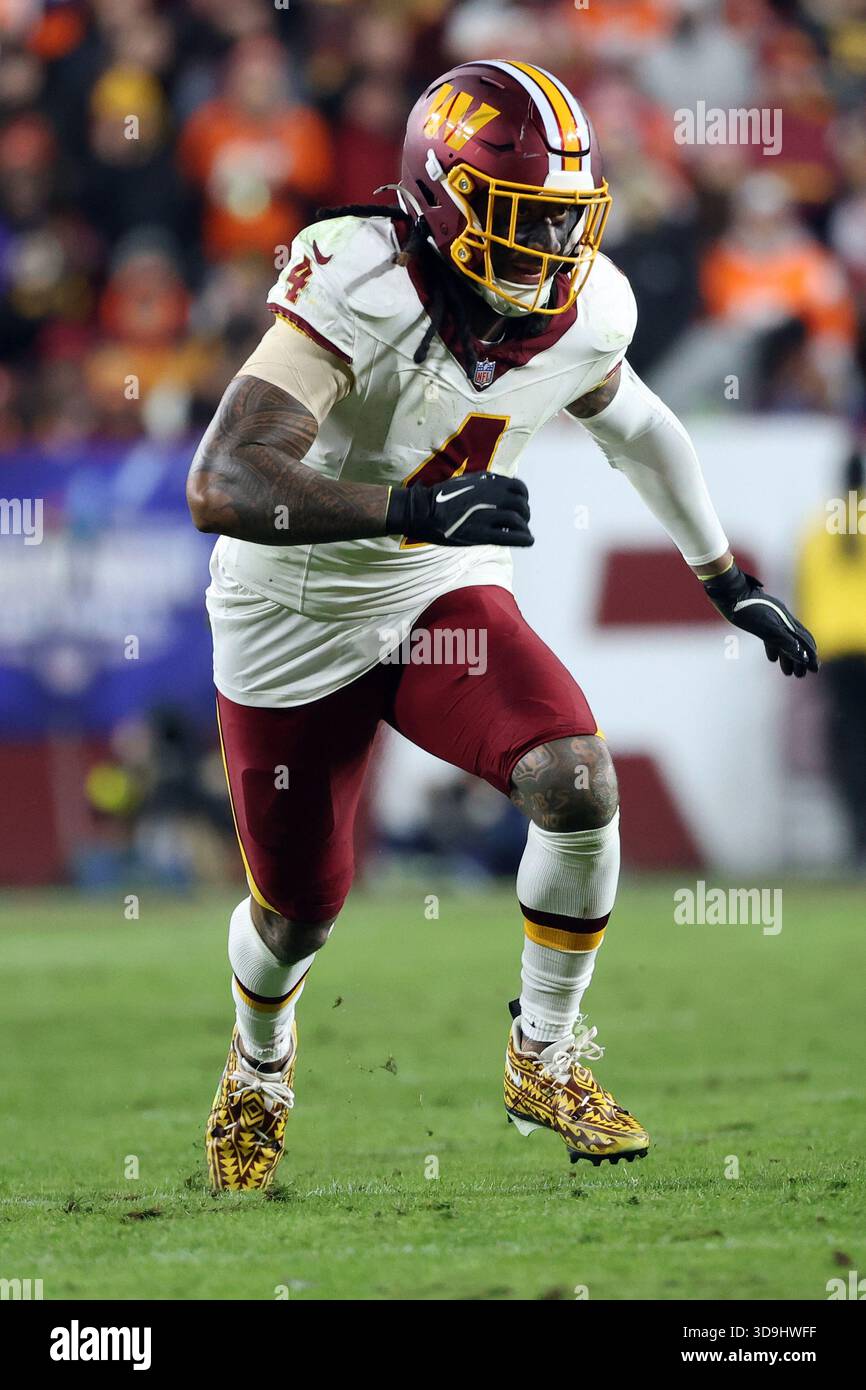 Washington Commanders linebacker Frankie Luvu (4) rushes during an NFL ...