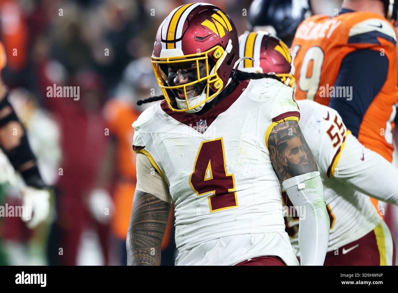 Washington Commanders linebacker Frankie Luvu (4) looks on during an ...