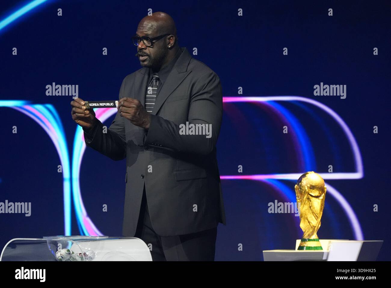 Former NBA player Shaquille O'Neal holds up the team name of South ...