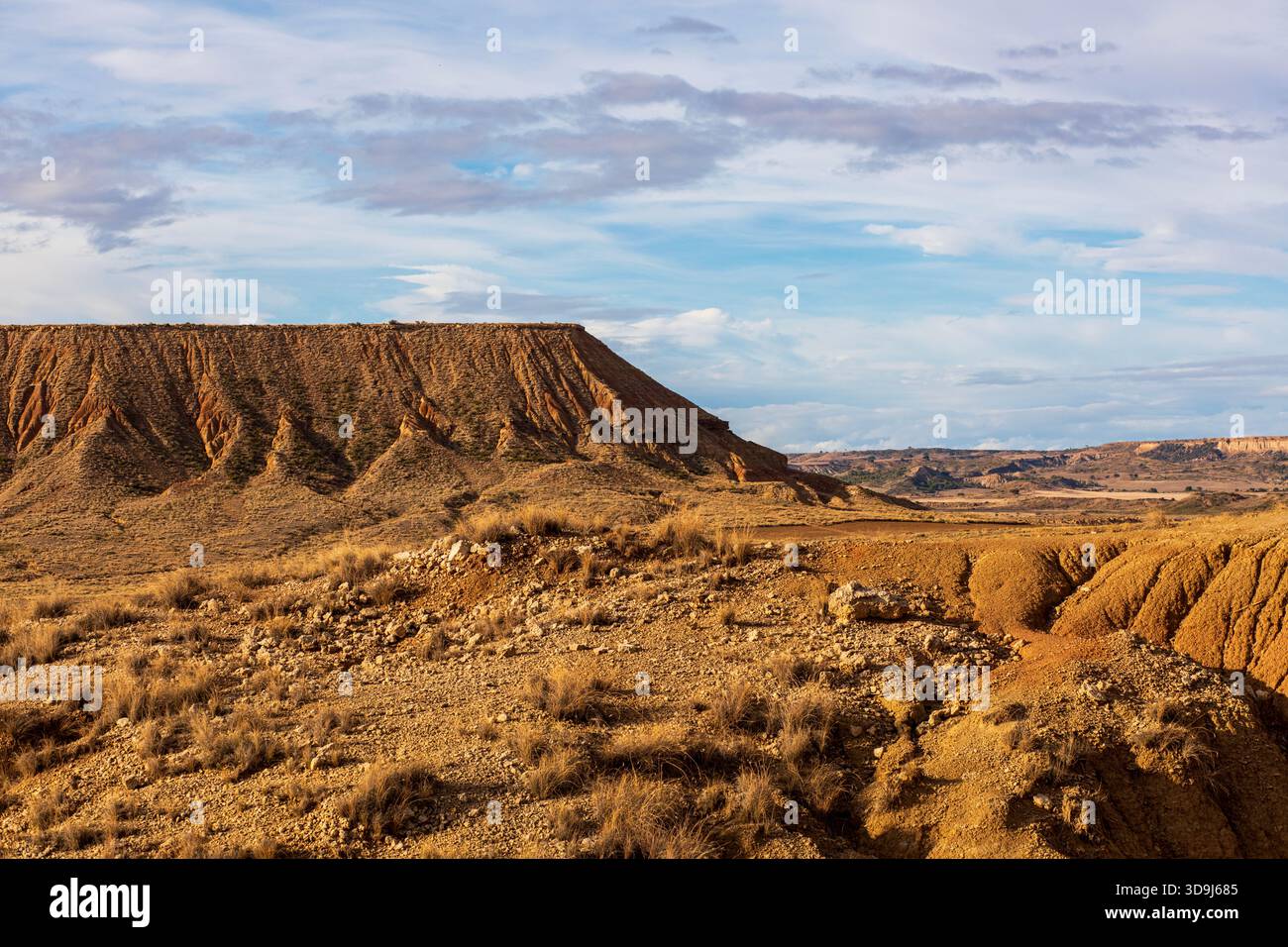 Stretching across the horizon, the rugged cliffs rise dramatically ...