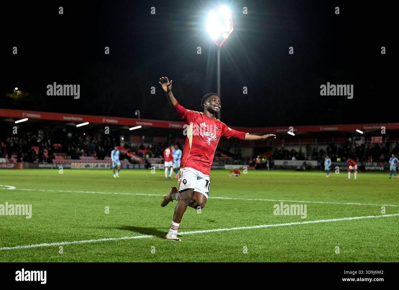 Salford City's Kelly N'Mai celebrates scoring their side's fourth goal ...