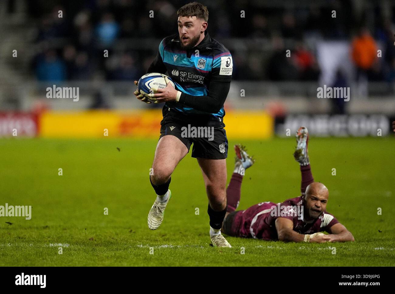 Glasgow Warriors' Ollie Smith skips away from Sale Sharks' Tom O ...