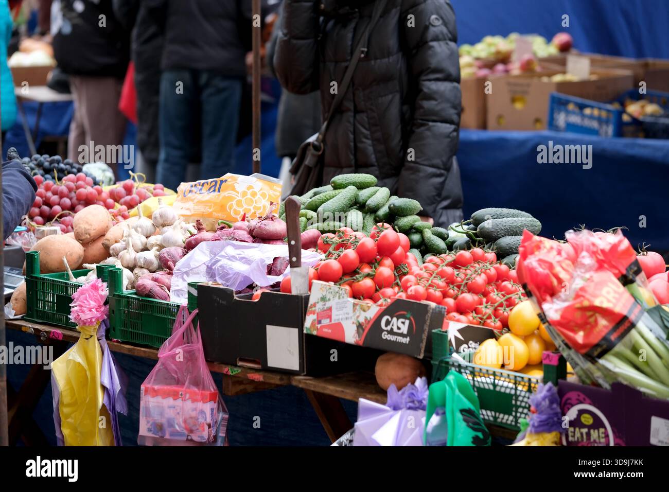 Vibrant display of fruits and vegetables in a bustling market setting ...