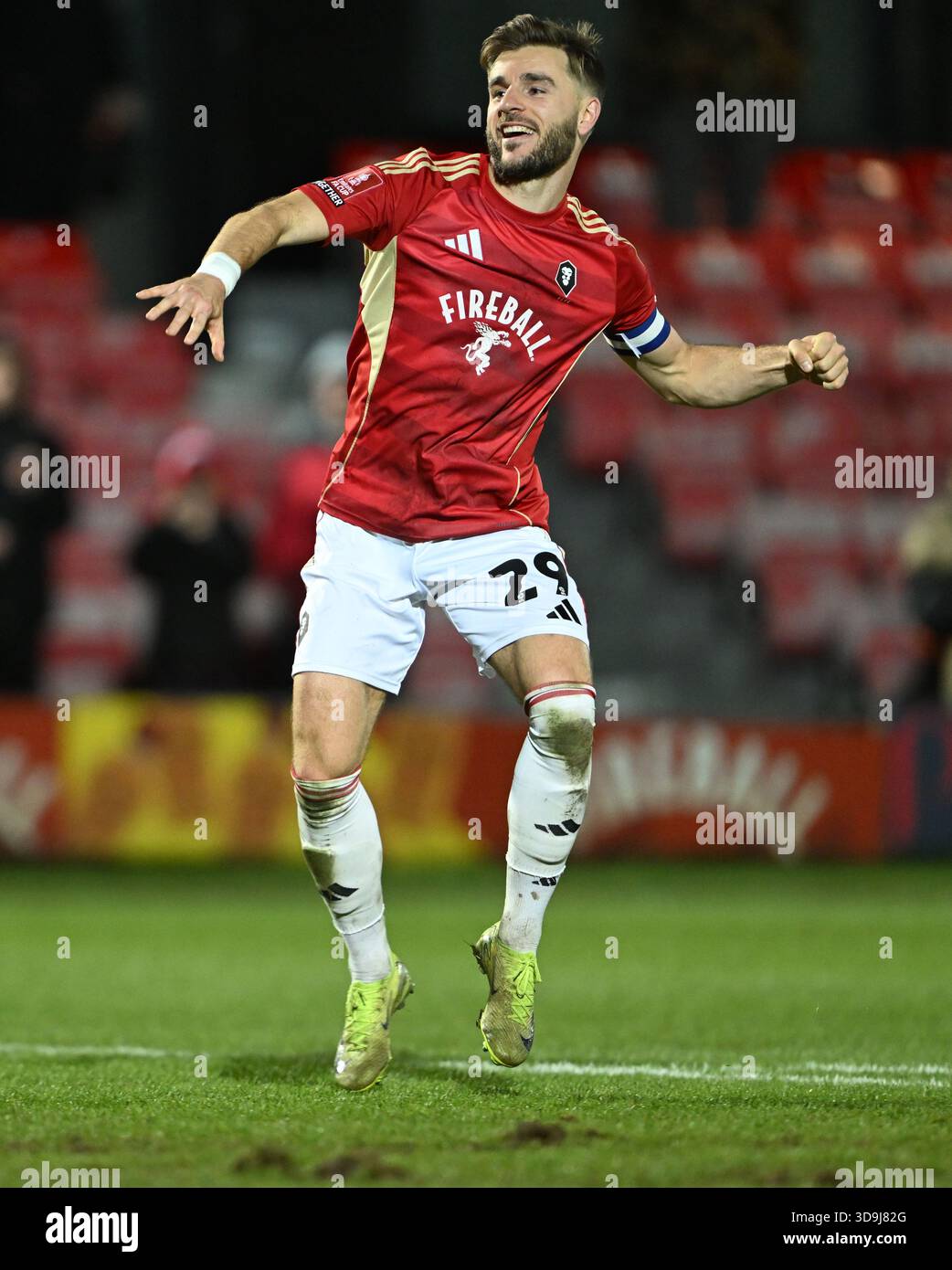Salford City's Luke Garbutt celebrates at the final whistle after the ...