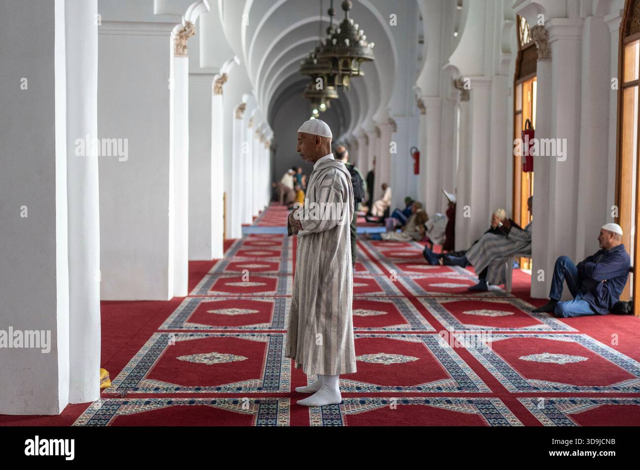A man performs a prayer inside Kotoubia mosque in Marrakech, Morocco ...