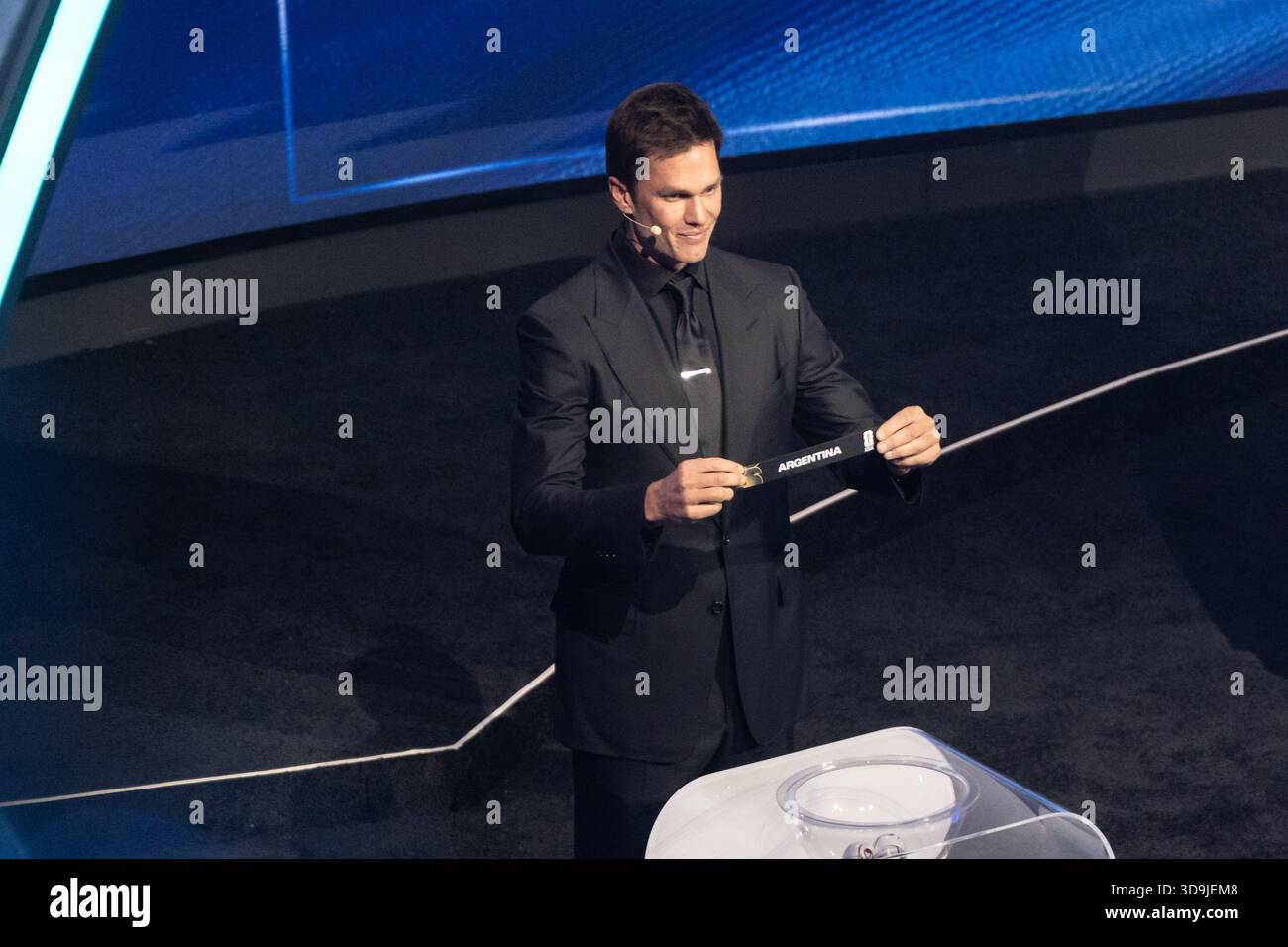 Tom Brady assists during the 2026 FIFA World Cup draw at the John F ...