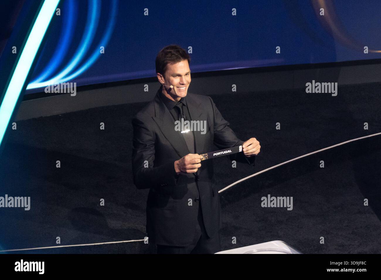 Tom Brady assists during the 2026 FIFA World Cup draw at the John F ...