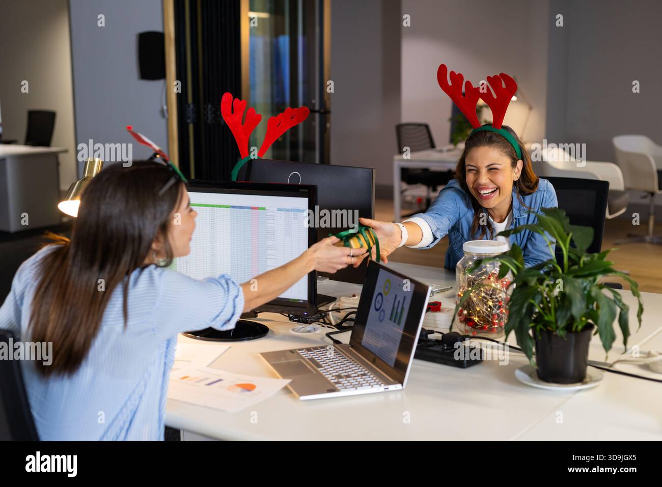 Diverse female coworkers in holiday hi-res stock photography and images ...