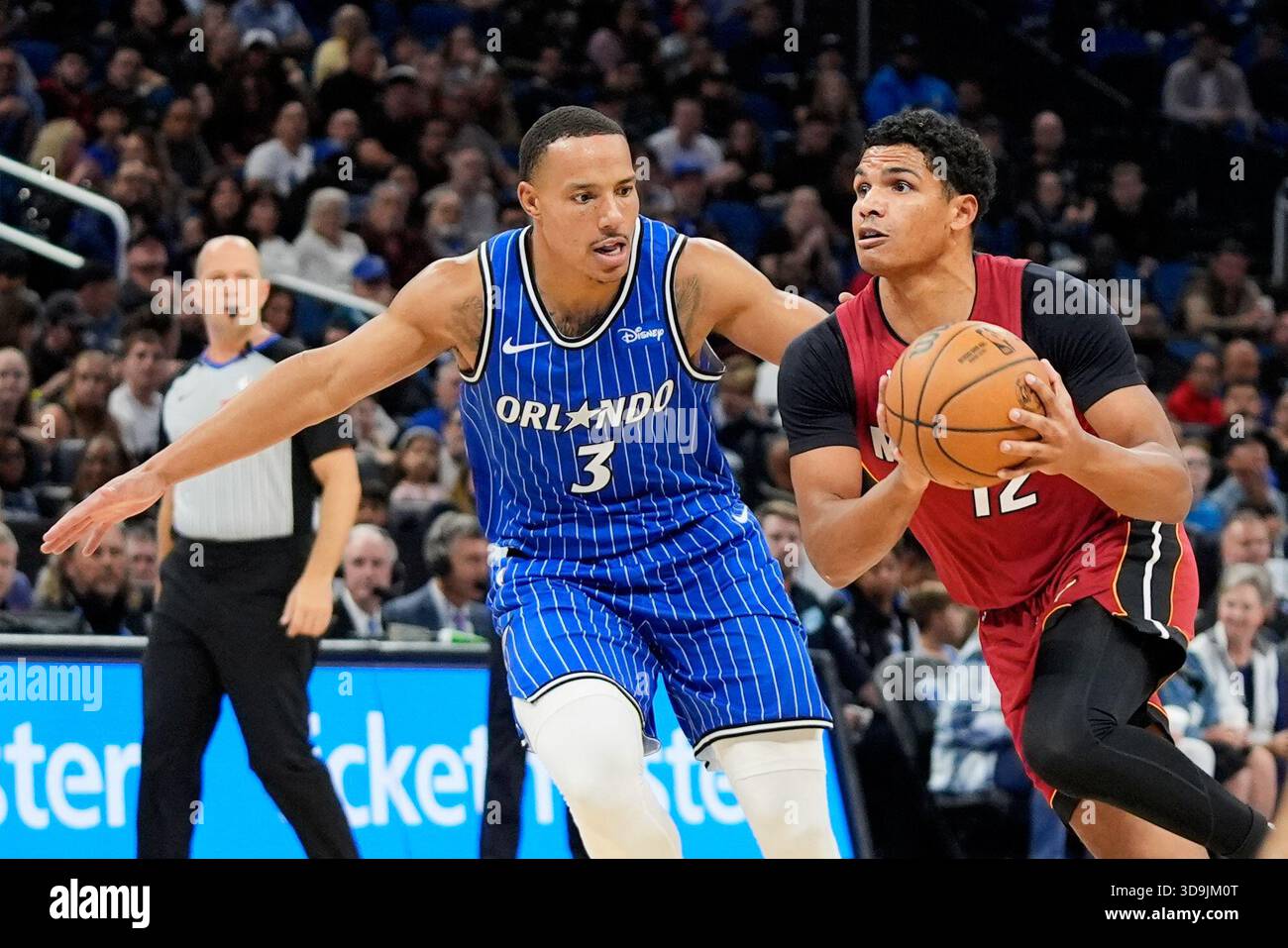 Miami Heat guard Dru Smith, right, drives around Orlando Magic guard ...