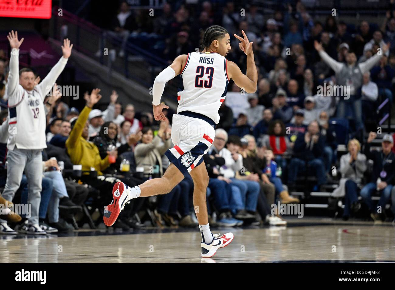 UConn forward Jayden Ross (23) gestures after making a basket in the ...