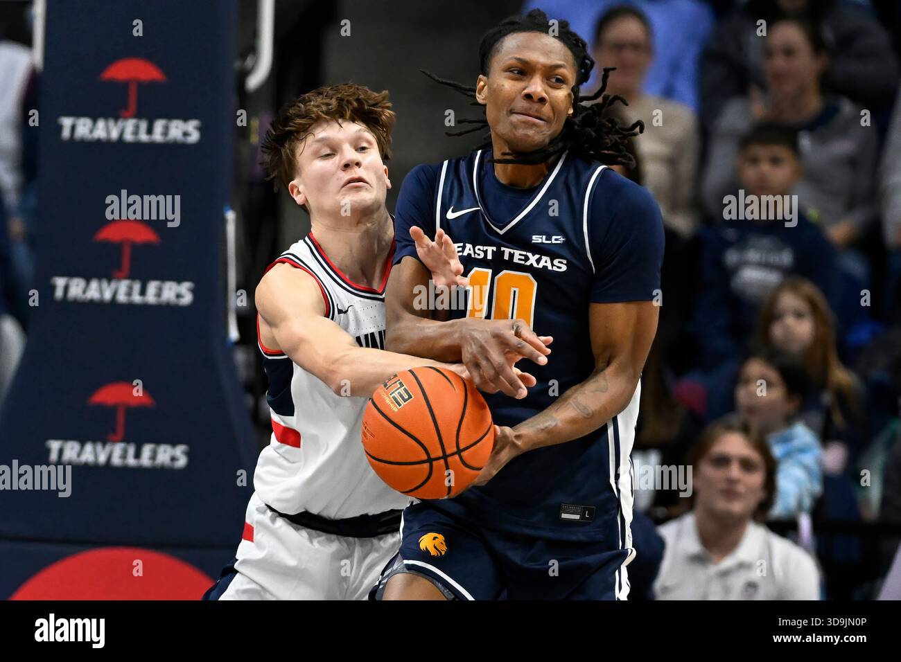 UConn guard Braylon Mullins, left, pressures East Texas A&M's Josh ...