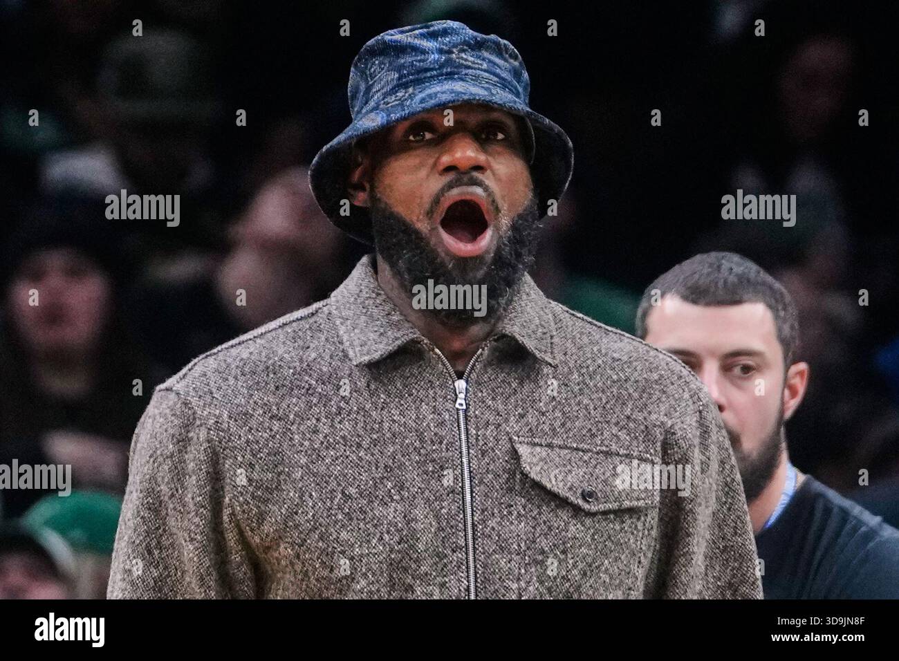 Los Angeles Lakers' Lebron James yawns while standing next to the bench ...
