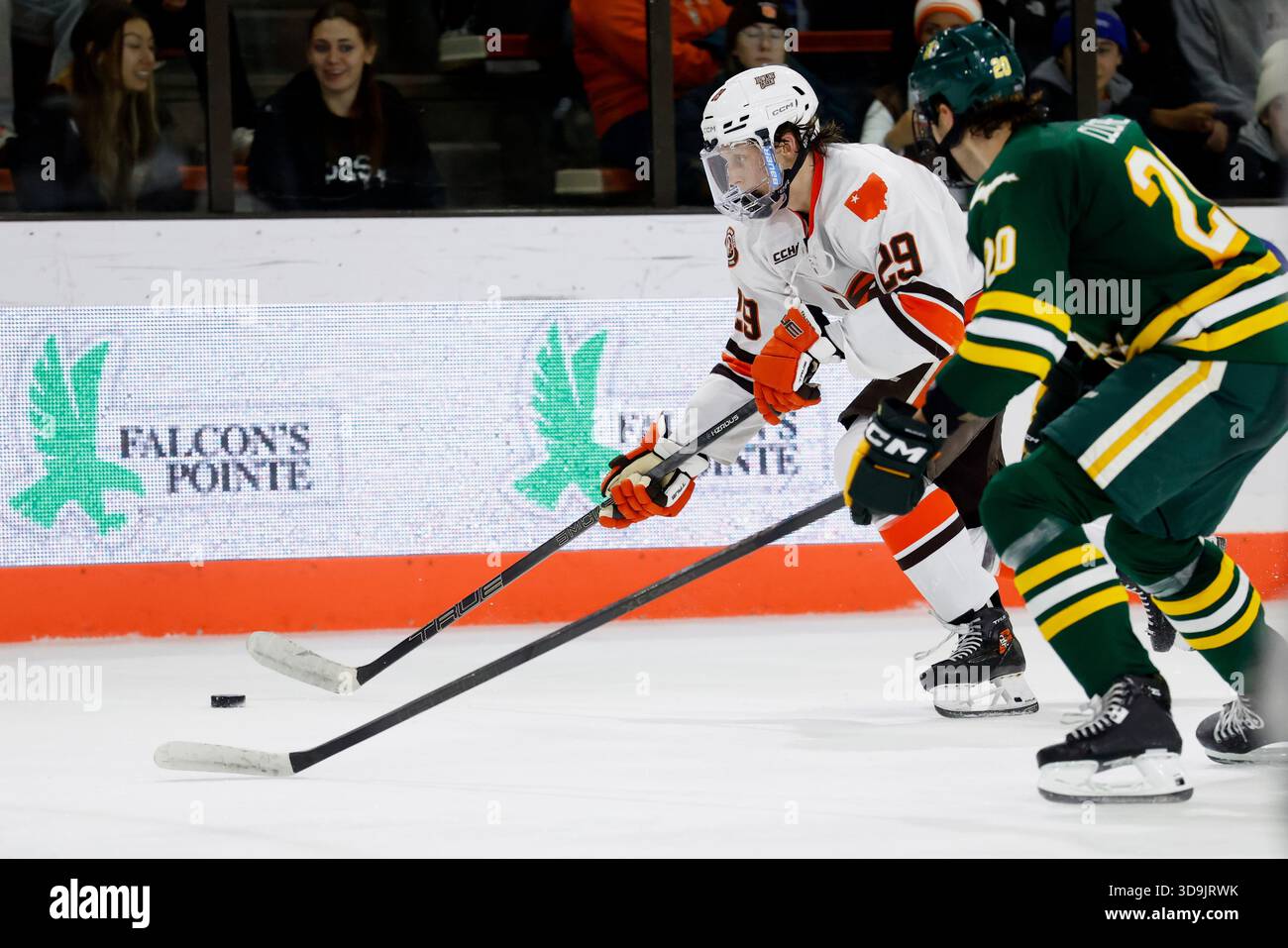 Bowling Green forward Brody Waters (29) skates with the puck defended ...