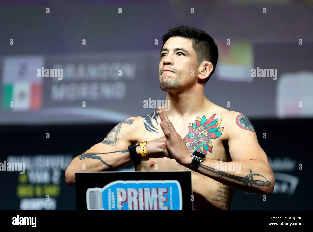 UFC flyweight fighter Brandon Moreno, of Mexico, poses on the scale ...