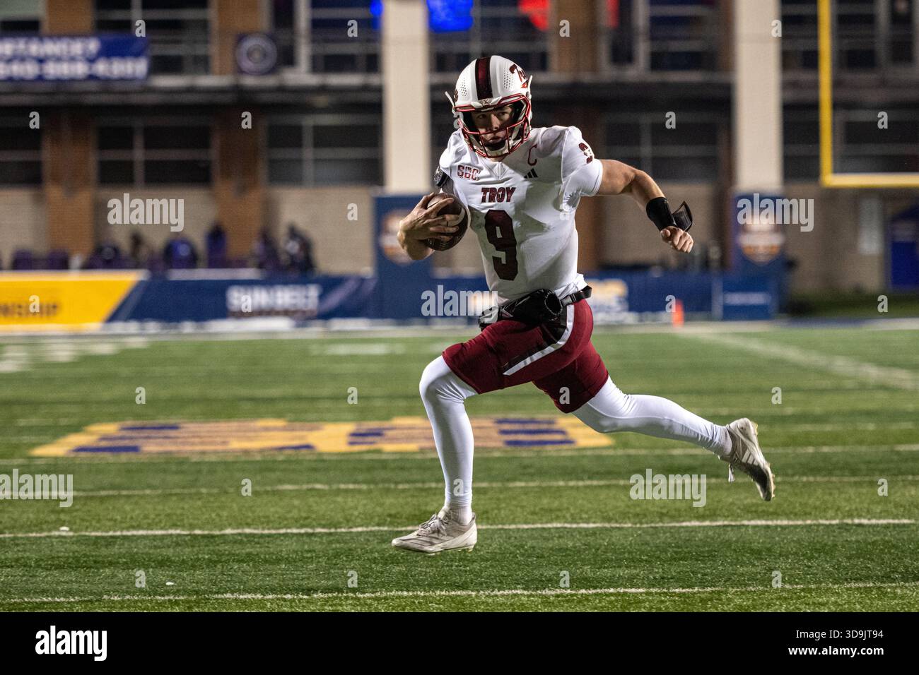 Troy quarterback Goose Crowder (9) runs the ball in for a touchdown ...