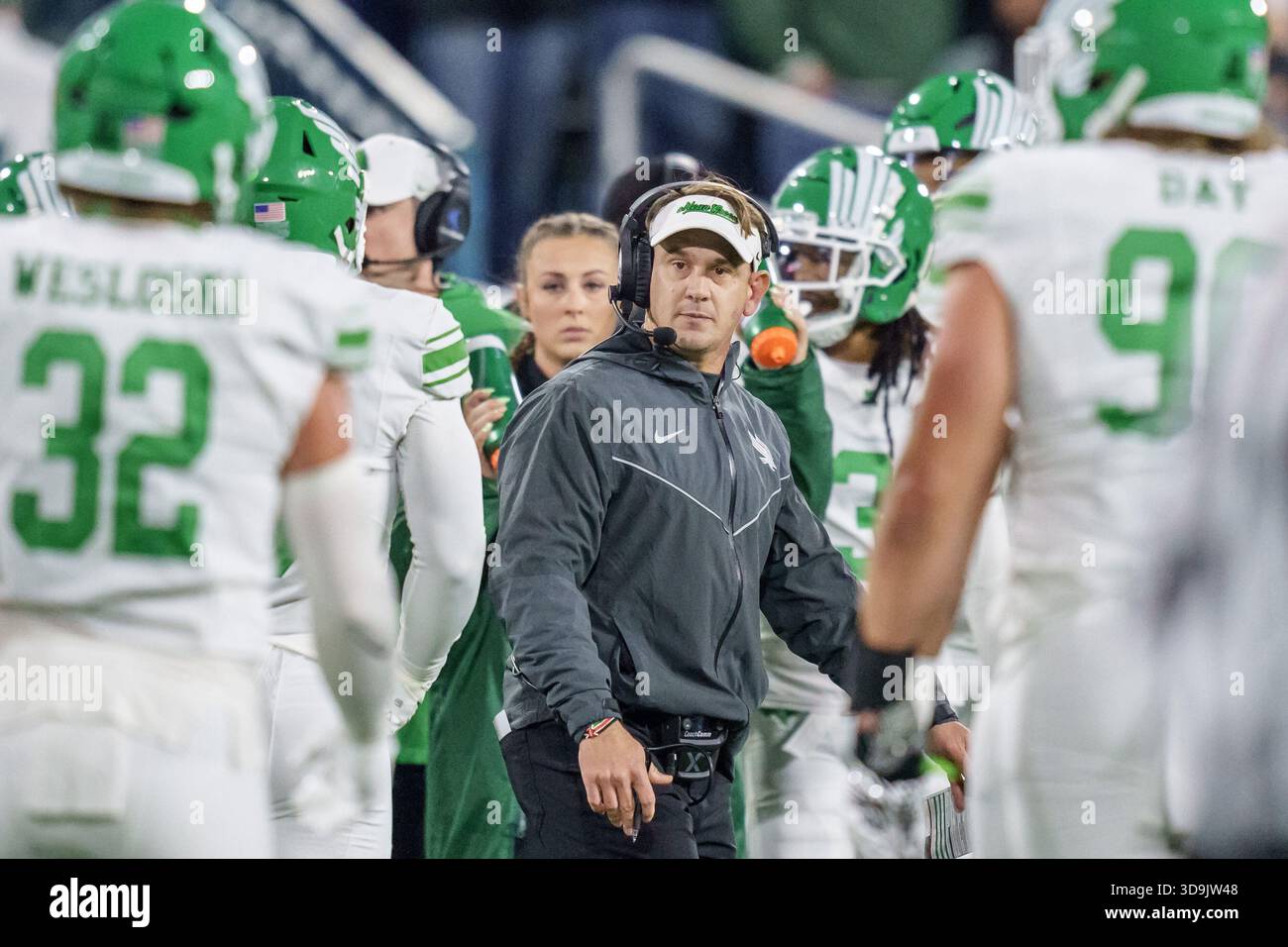 North Texas head coach Eric Morris, center, reacts during the first ...