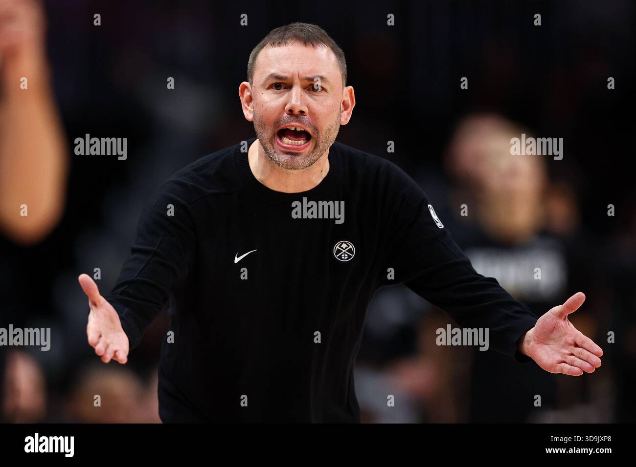 Denver Nuggets head coach David Adelman reacts during the first half of ...