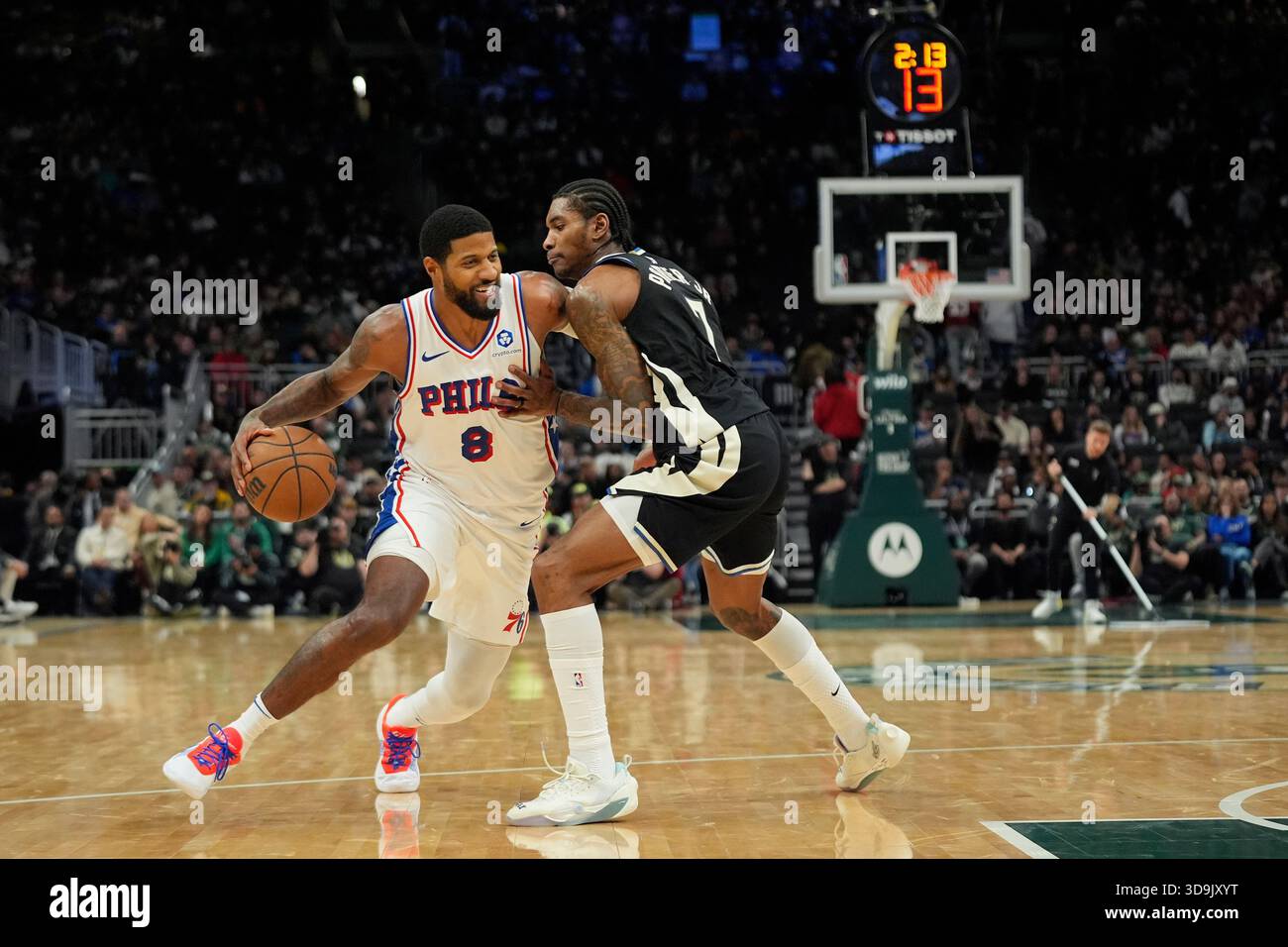 Philadelphia 76ers' Paul George (8) drives to the basket against ...