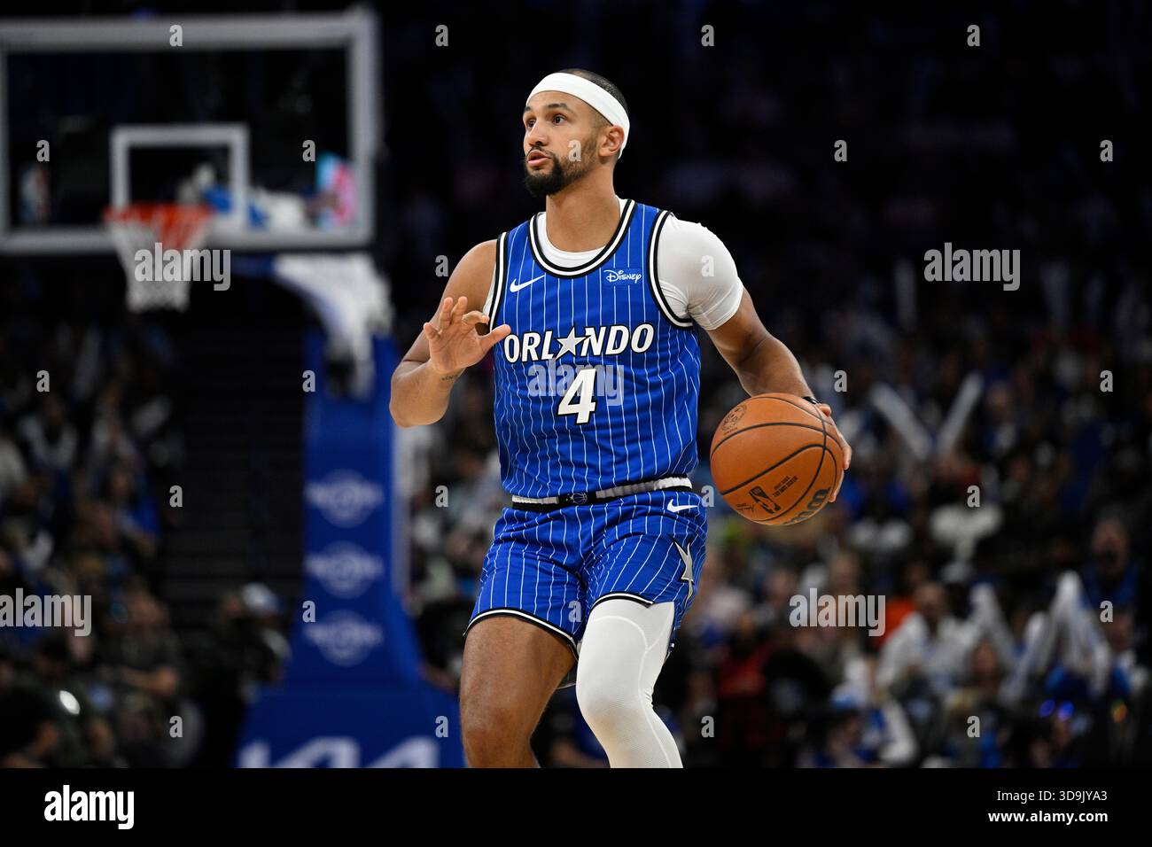 Orlando Magic guard Jalen Suggs (4) brings the ball up the court ...