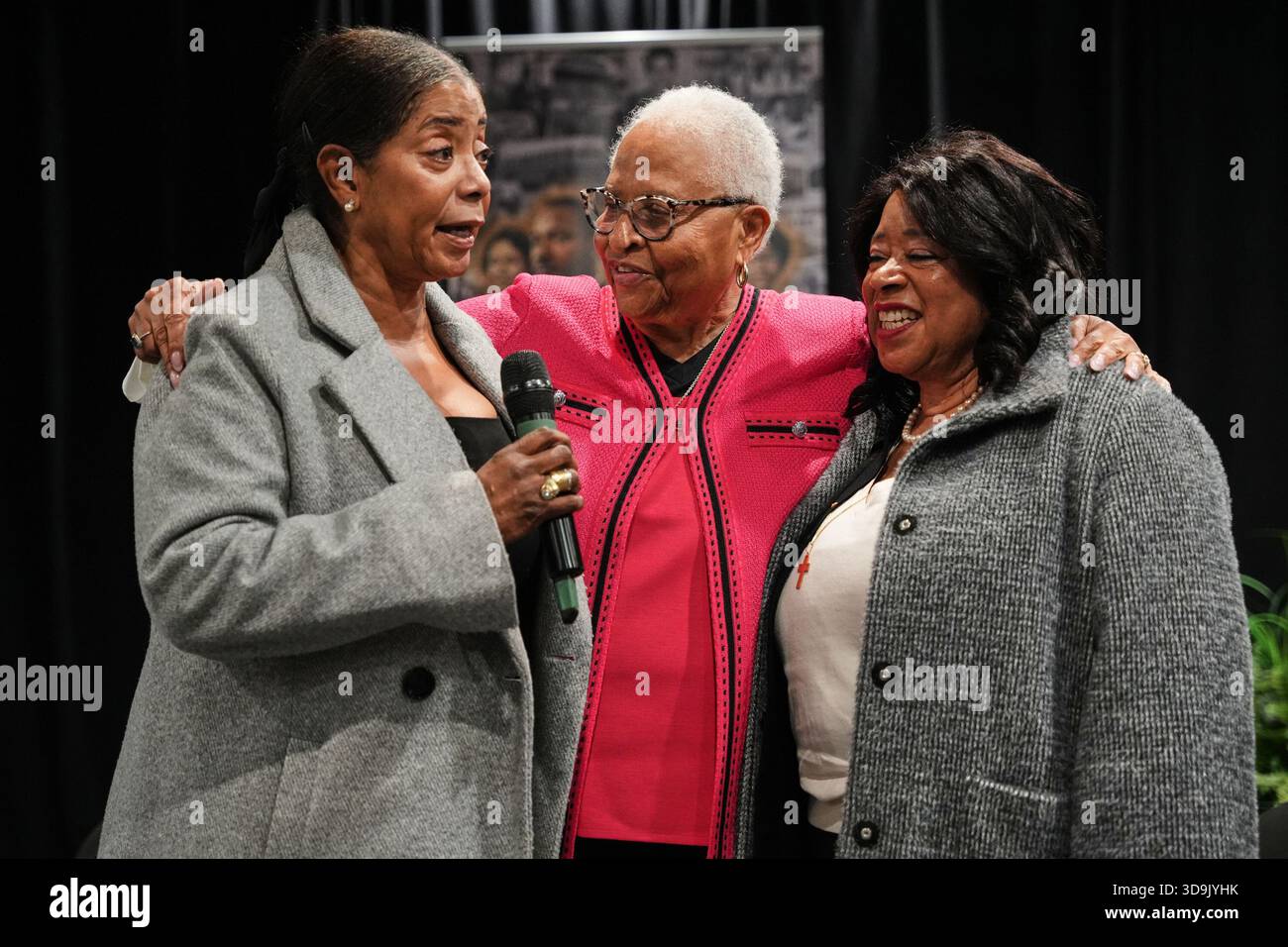 Doris Crenshaw, center, embraces Donzaleigh Abernathy, left, and ...