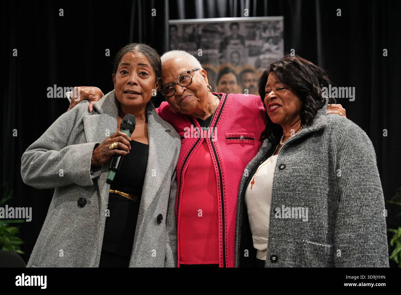 Doris Crenshaw, center, embraces Donzaleigh Abernathy, left, and ...