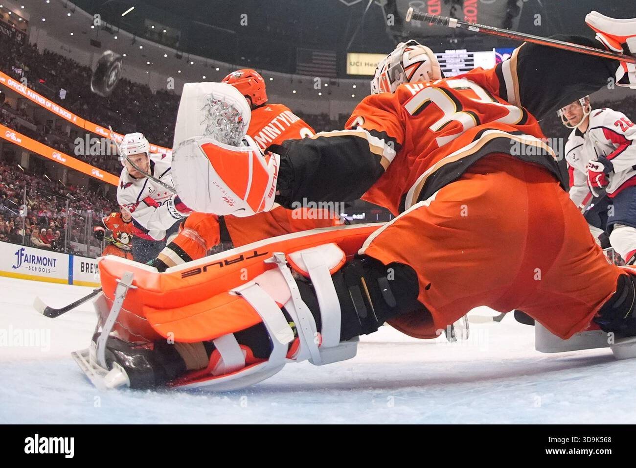 Washington Capitals center Ethen Frank, left, scores on Anaheim Ducks ...