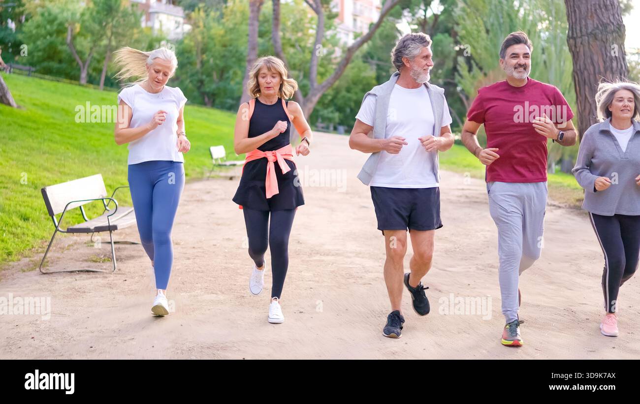 Group people jogging in park hi-res stock photography and images - Alamy