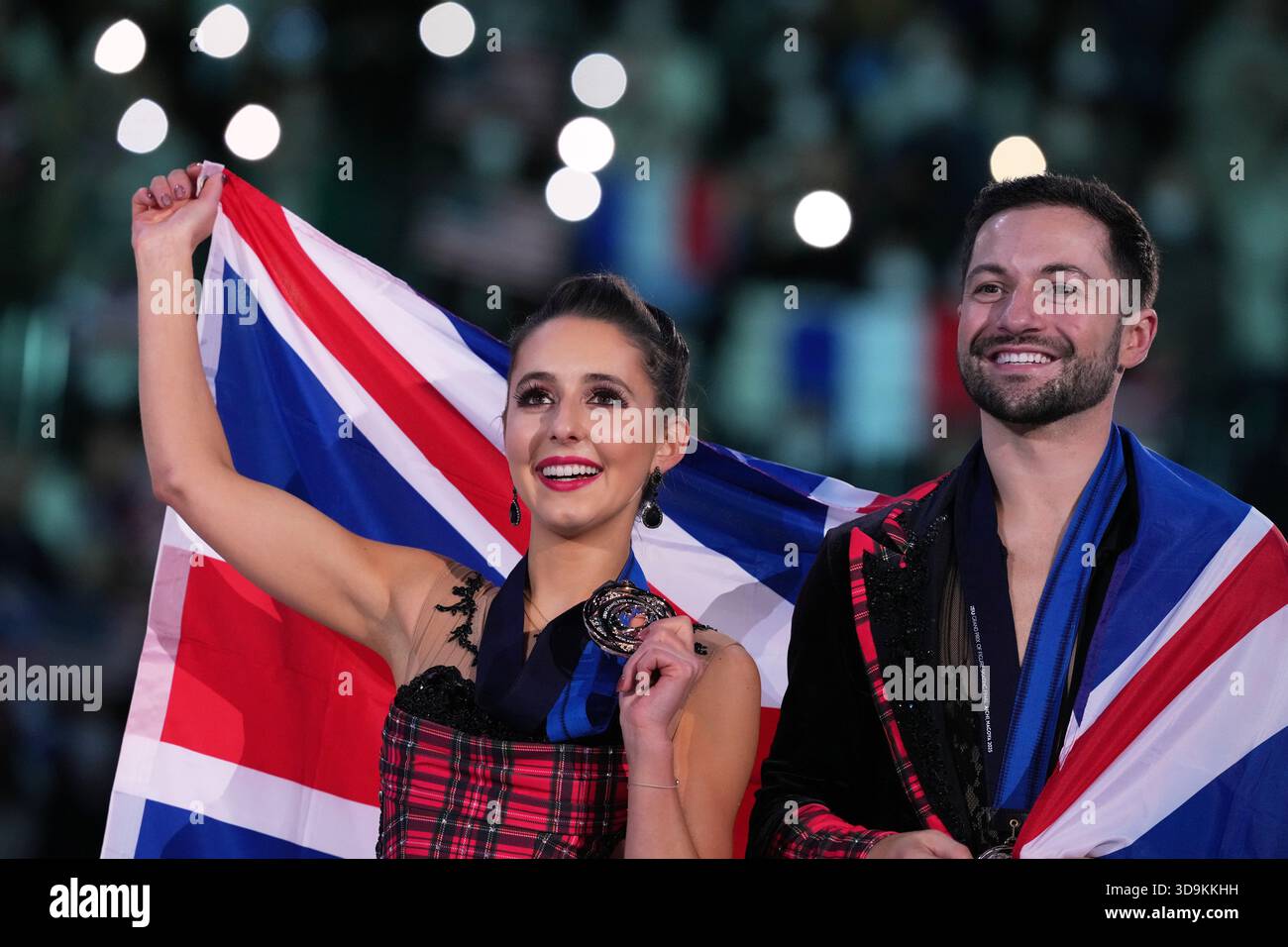 Lilah Fear and Lewis Gibson, of Great Britain, pose after winning the ...
