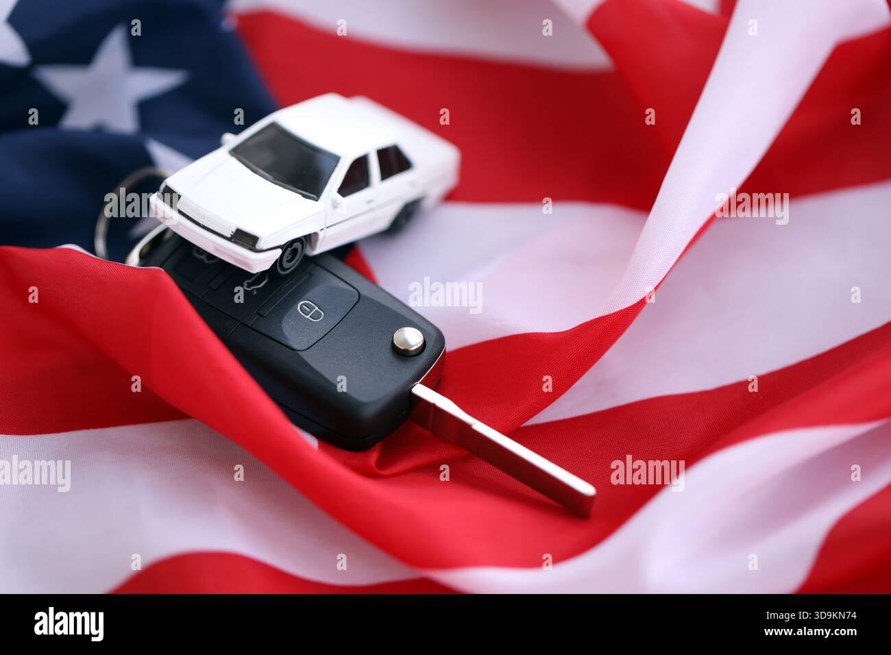 Ignition keys with remote control buttons and toy car on United States ...