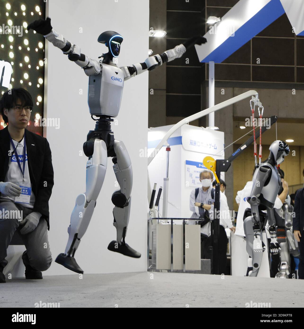 A humanoid robot developed by China's Unitree Robotics performs during ...