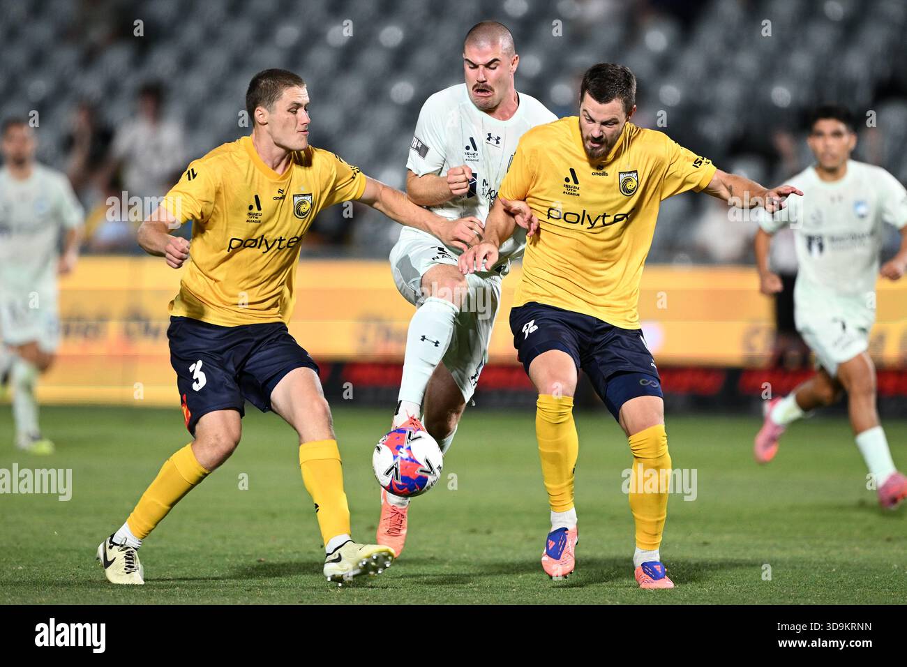 Patrick Wood of Sydney competes for possession with Nathan Paull (left ...