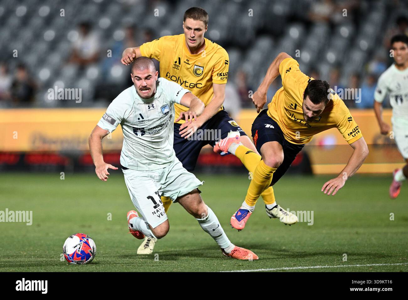 Patrick Wood of Sydney competes for possession with Nathan Paull (left ...