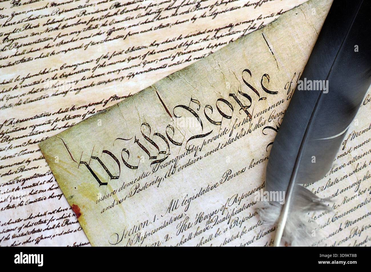United States constitution first page in light brown tones close up. We ...