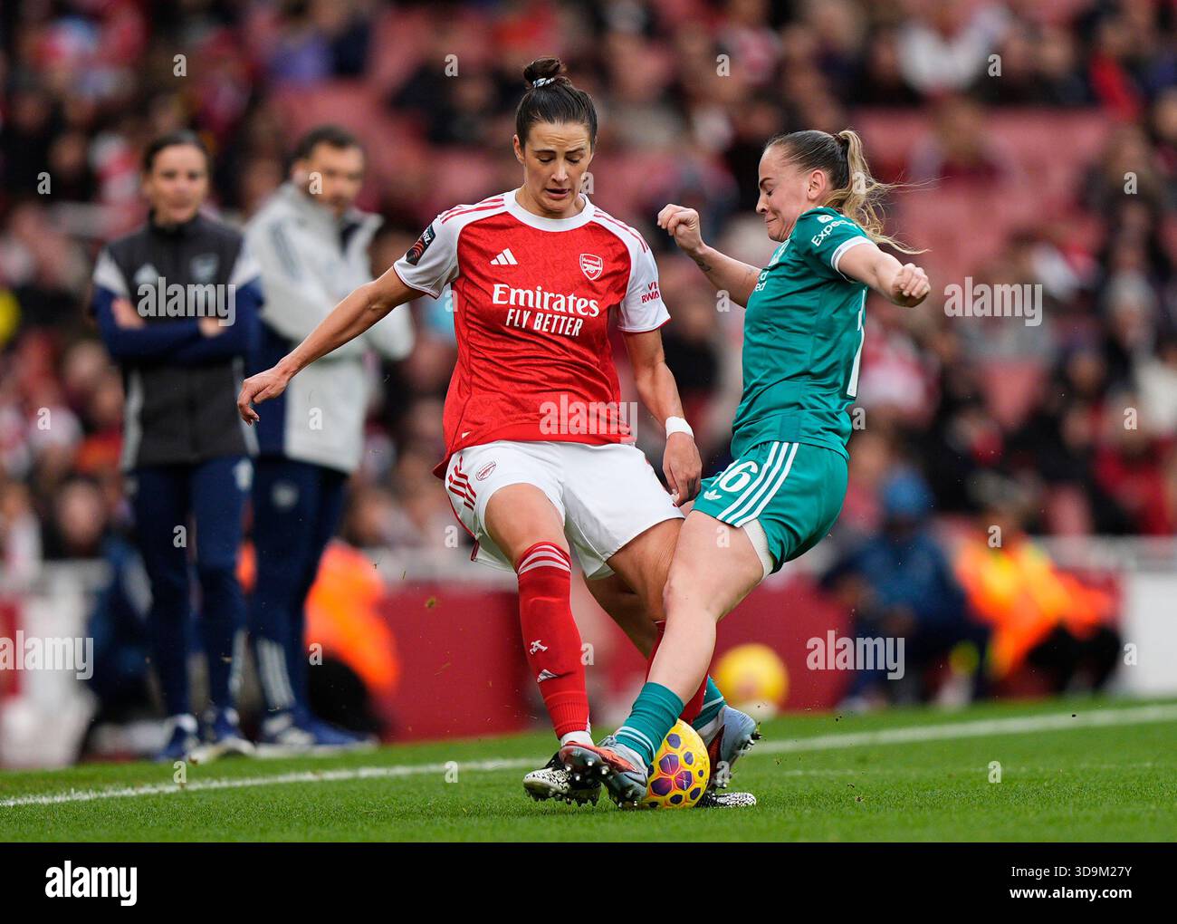 Arsenal's Emily Fox and Liverpool's Lily Woodham battle for the ball ...