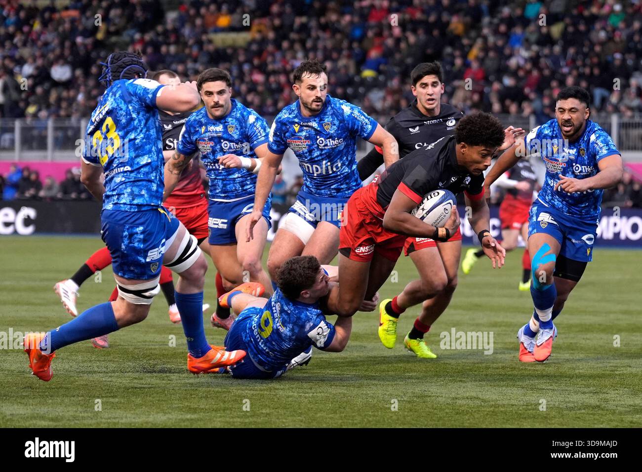 Saracens' Noah Caluori is tackled by ASM Clermont Auvergne's Baptiste Jauneau during the ...
