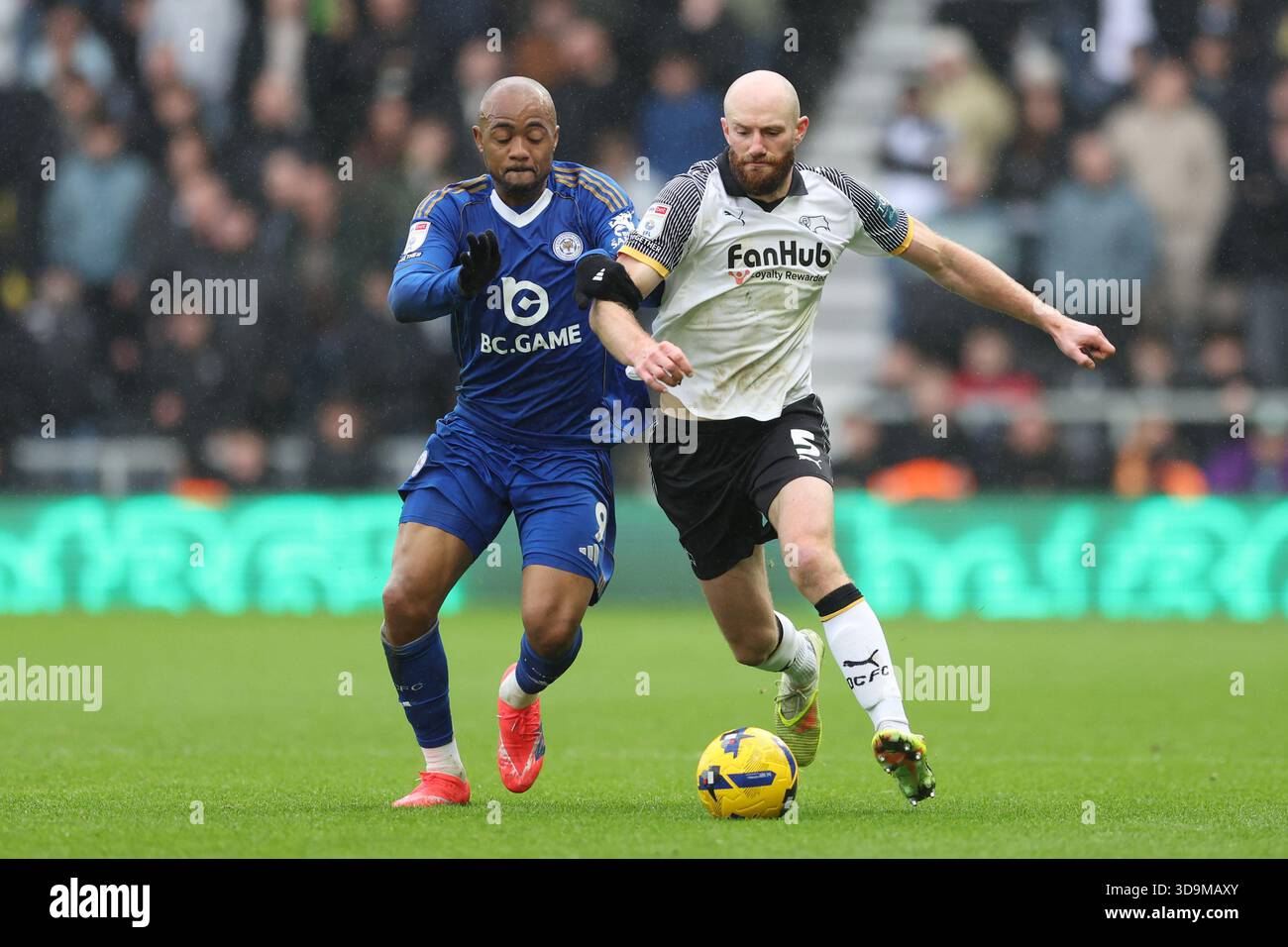 Derby County's Matthew Clarke (right) and Leicester City's Jordan Ayew ...