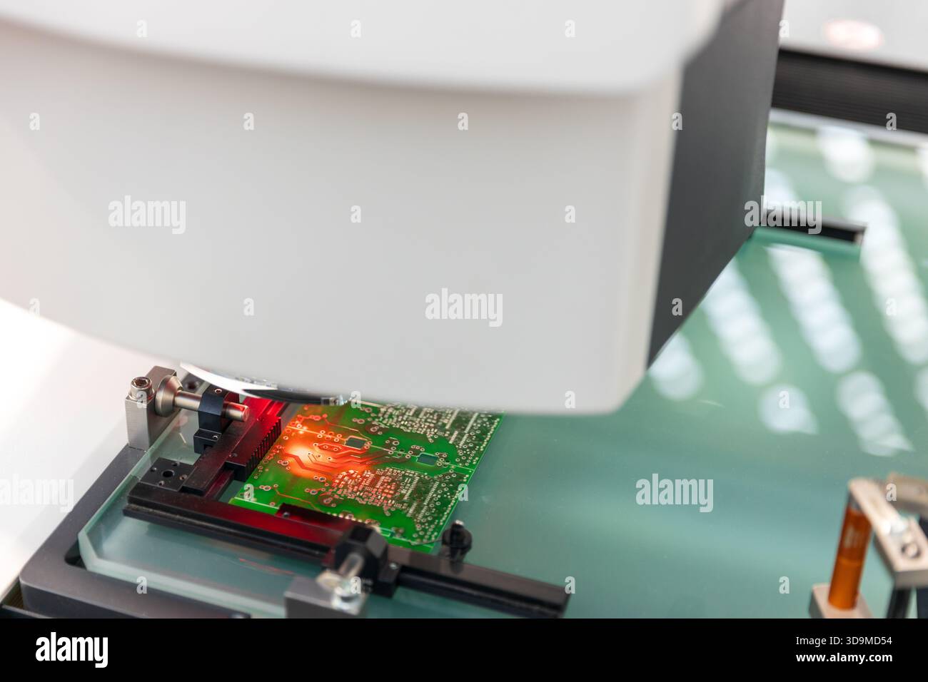Close-up of an automated optical inspection (AOI) machine scanning a ...