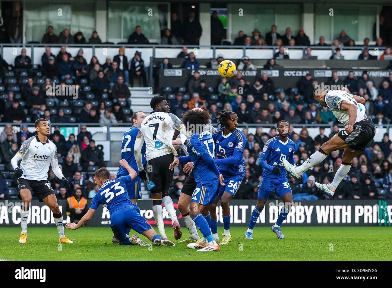 35, Curtis Nelson of Derby County heads the ball towards goal during ...