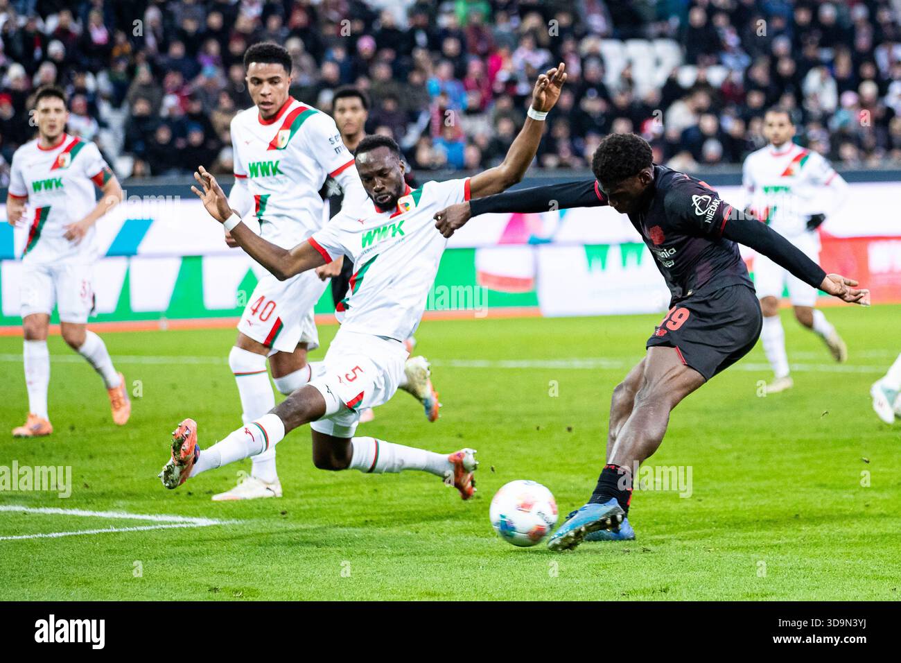 Shot on goal by Ernest Poku (Bayer 04 Leverkusen, #19) Chrislain ...