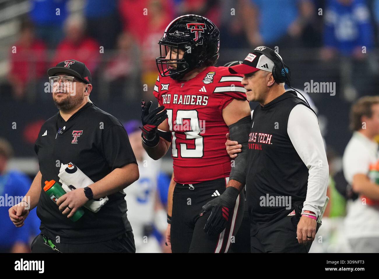 Texas Tech linebacker Ben Roberts (13) walks off the field with team ...
