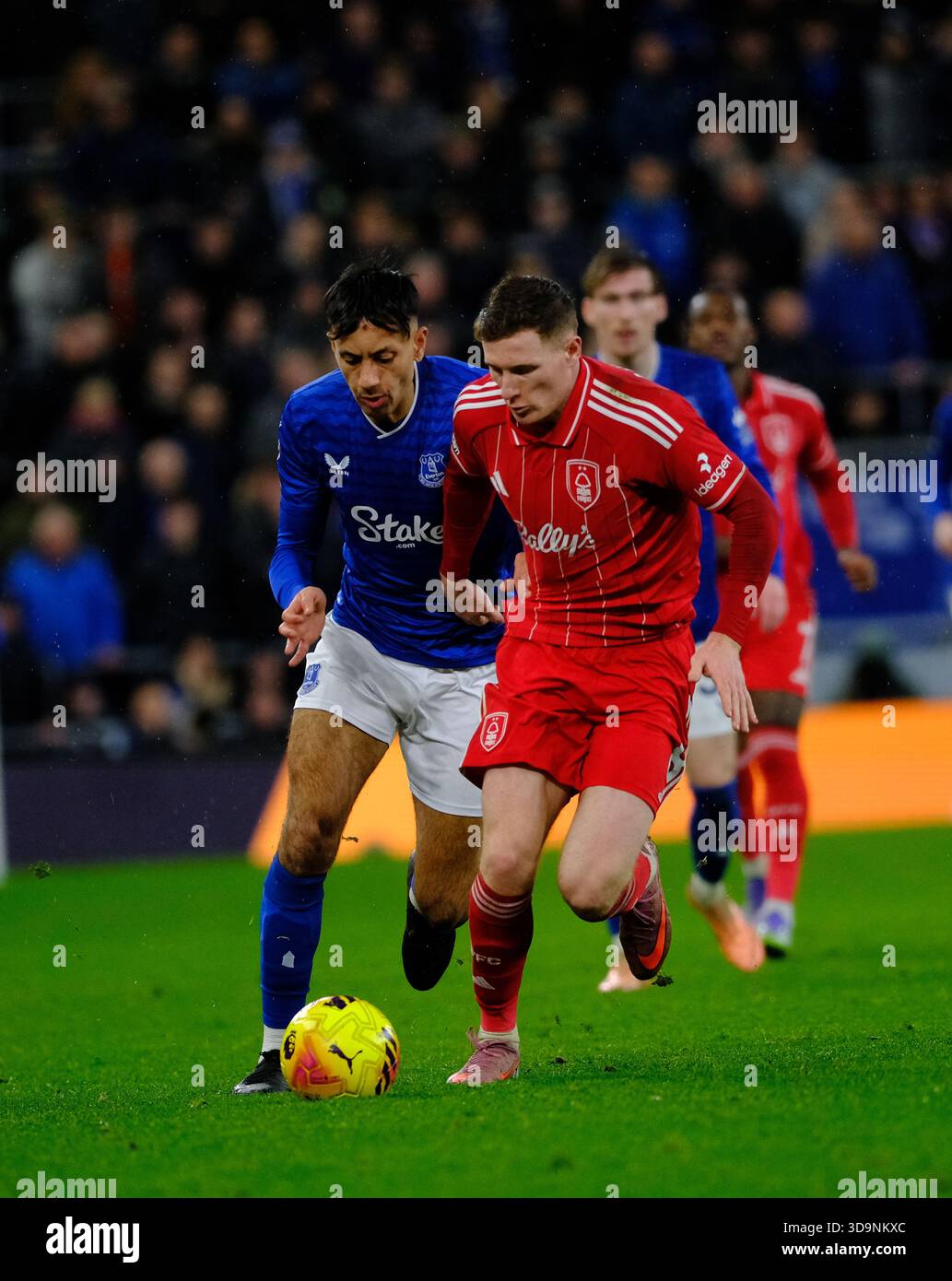 Dwight McNeil of Everton and Elliot Anderson of Nottingham Forest seen ...