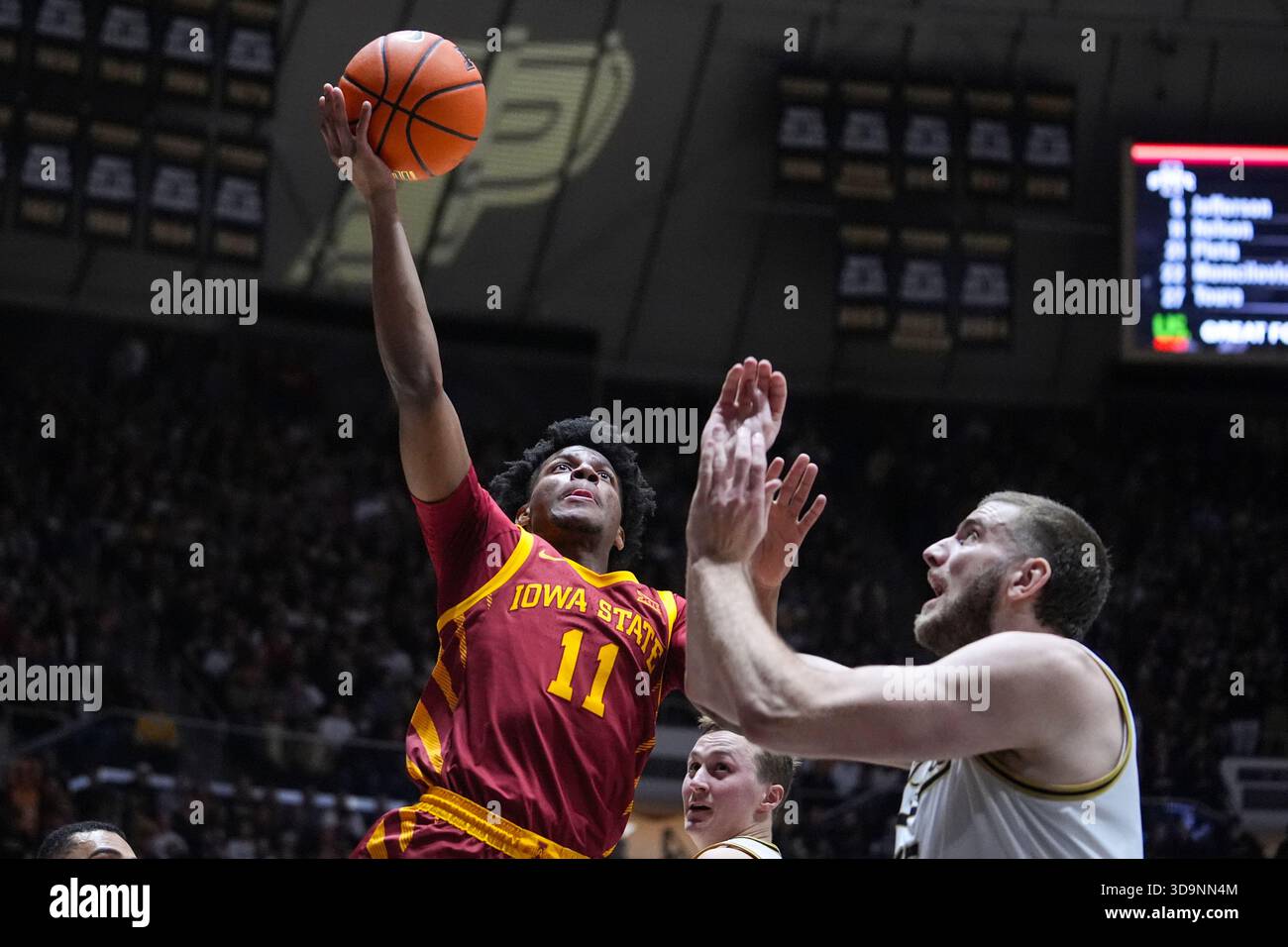 Iowa State guard Dominick Nelson (11) shoots over Purdue center Oscar ...